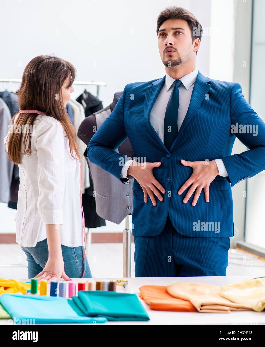 Tailor taking measurements customer hi-res stock photography and images ...