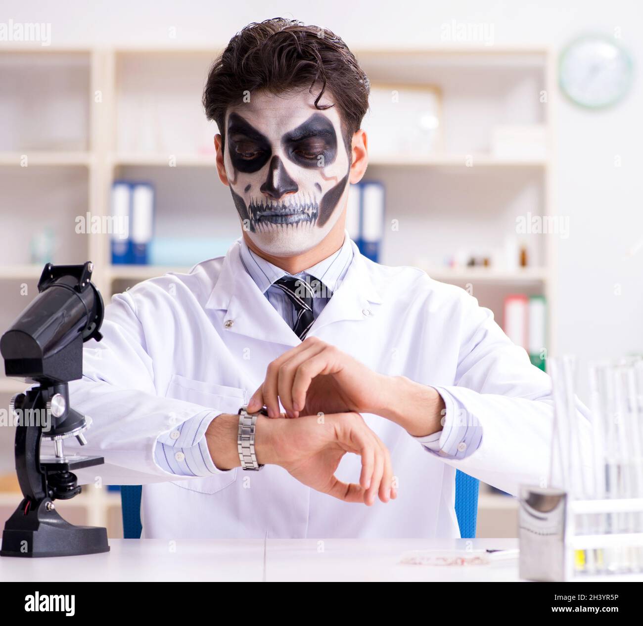 Scary monster doctor working in lab Stock Photo - Alamy
