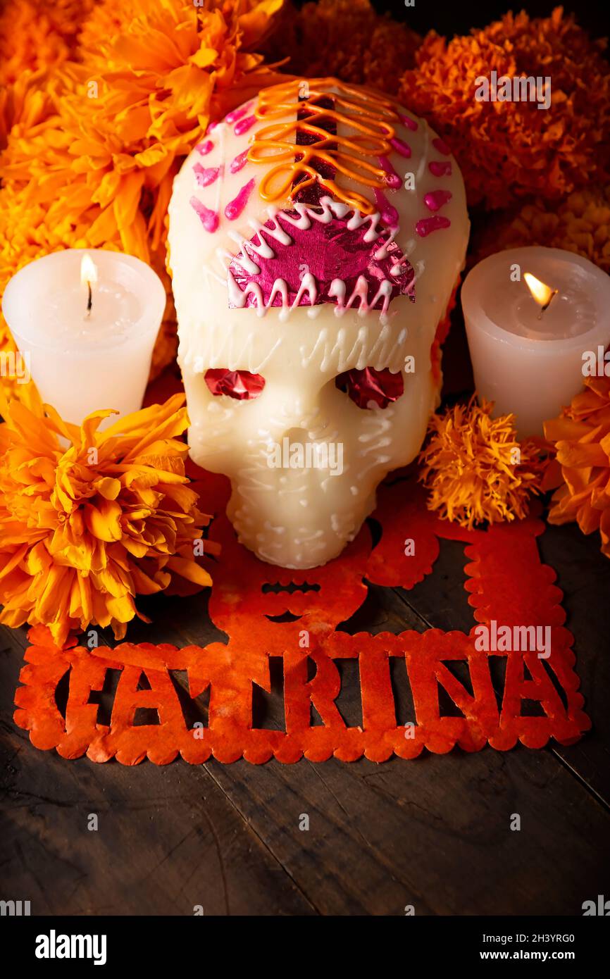 sugar-skull-with-candles-cempasuchil-flowers-or-marigold-and-papel