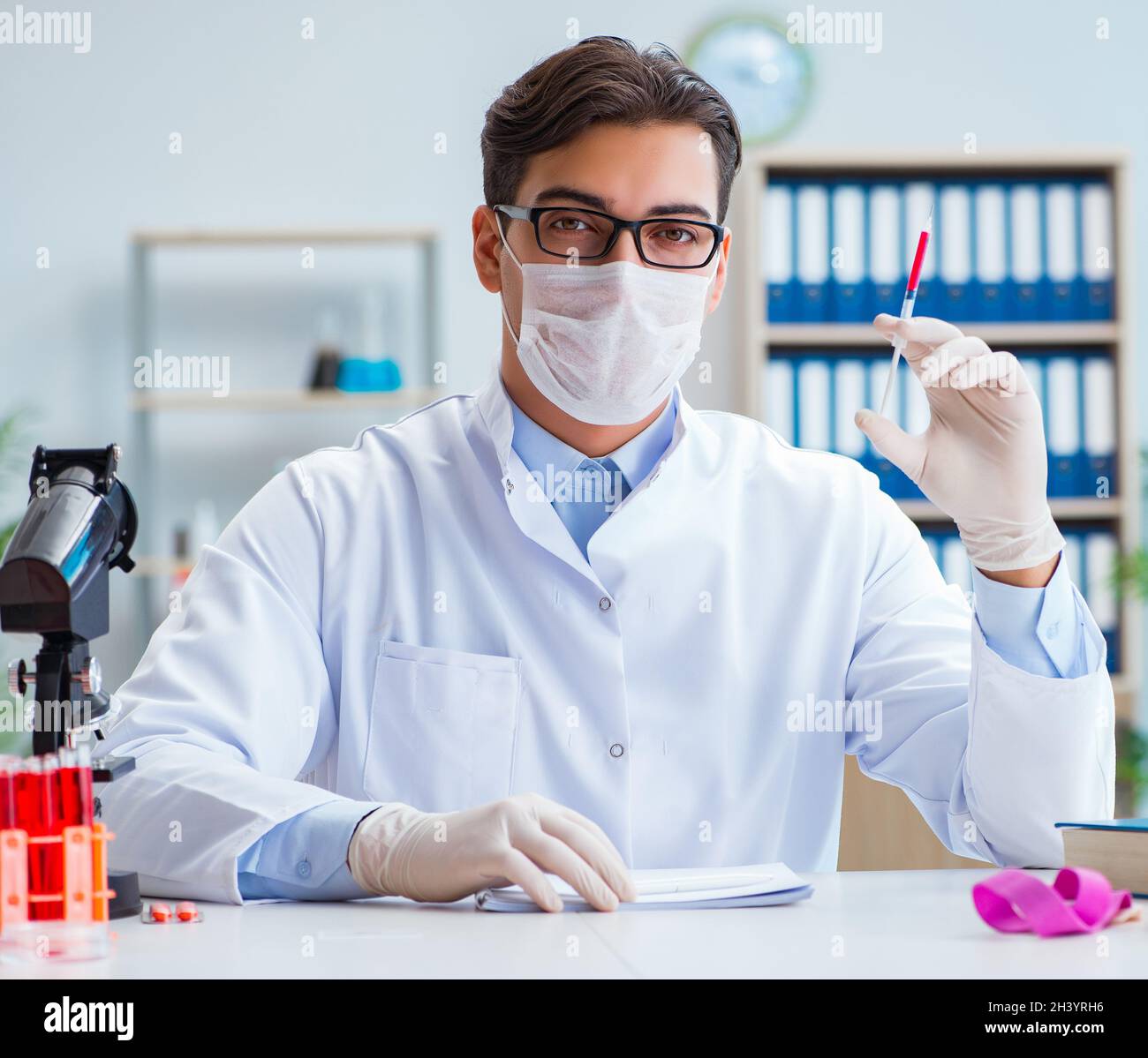 Doctor working with blood samples Stock Photo - Alamy