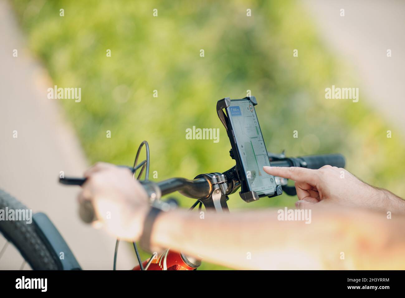 Man planning route using GPS navigation application in mobile phone on ...