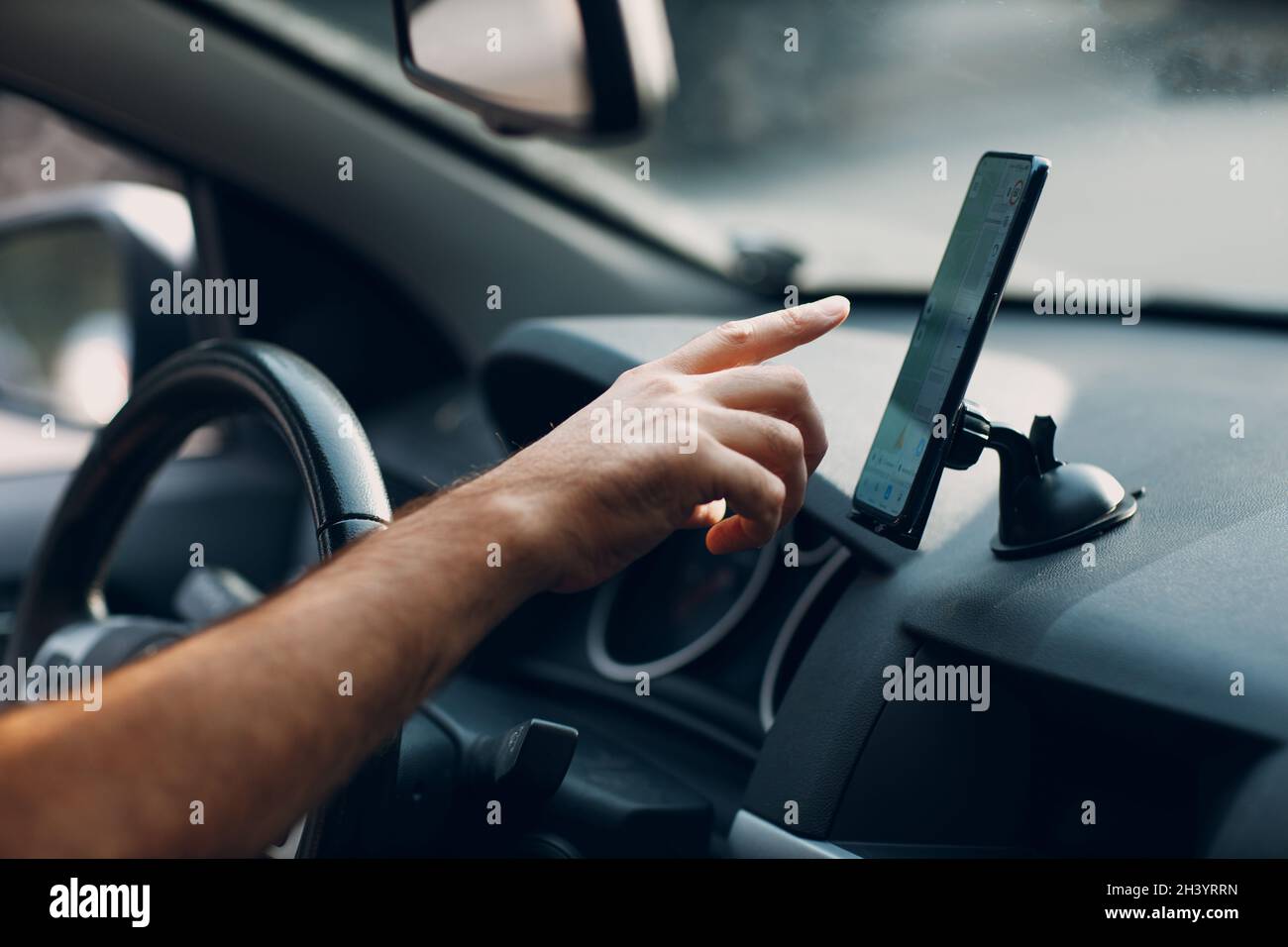 Navigator in car vehicle transportation commuter. Driver man using ...