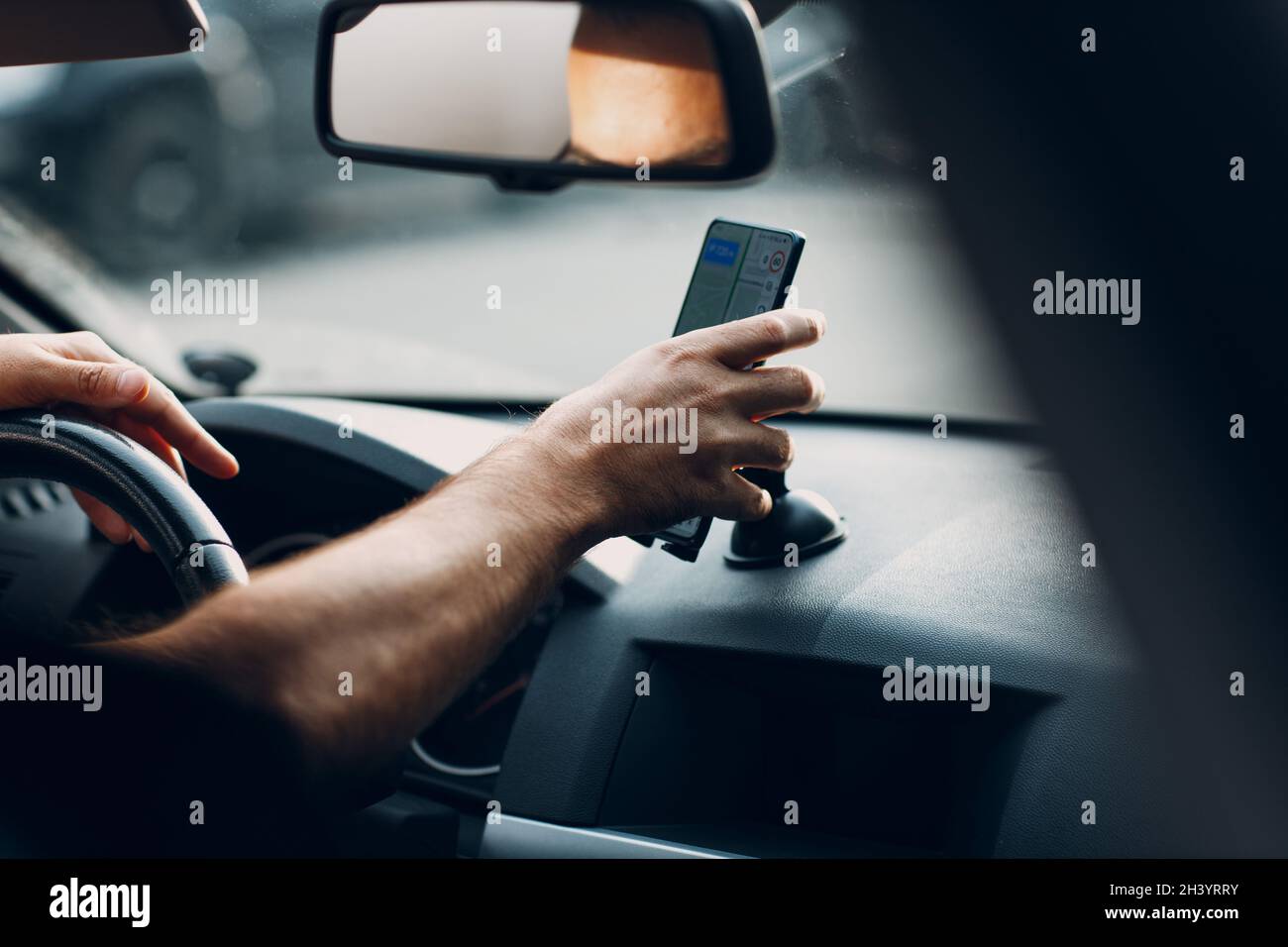 Navigator in car vehicle transportation commuter. Driver man using ...