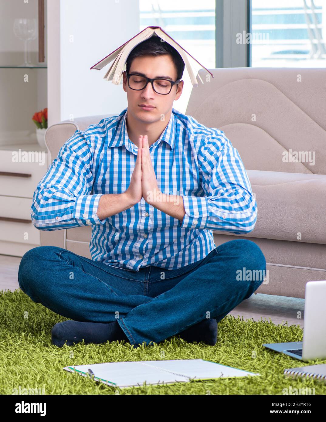 Student meditating and preparing for university exams Stock Photo - Alamy