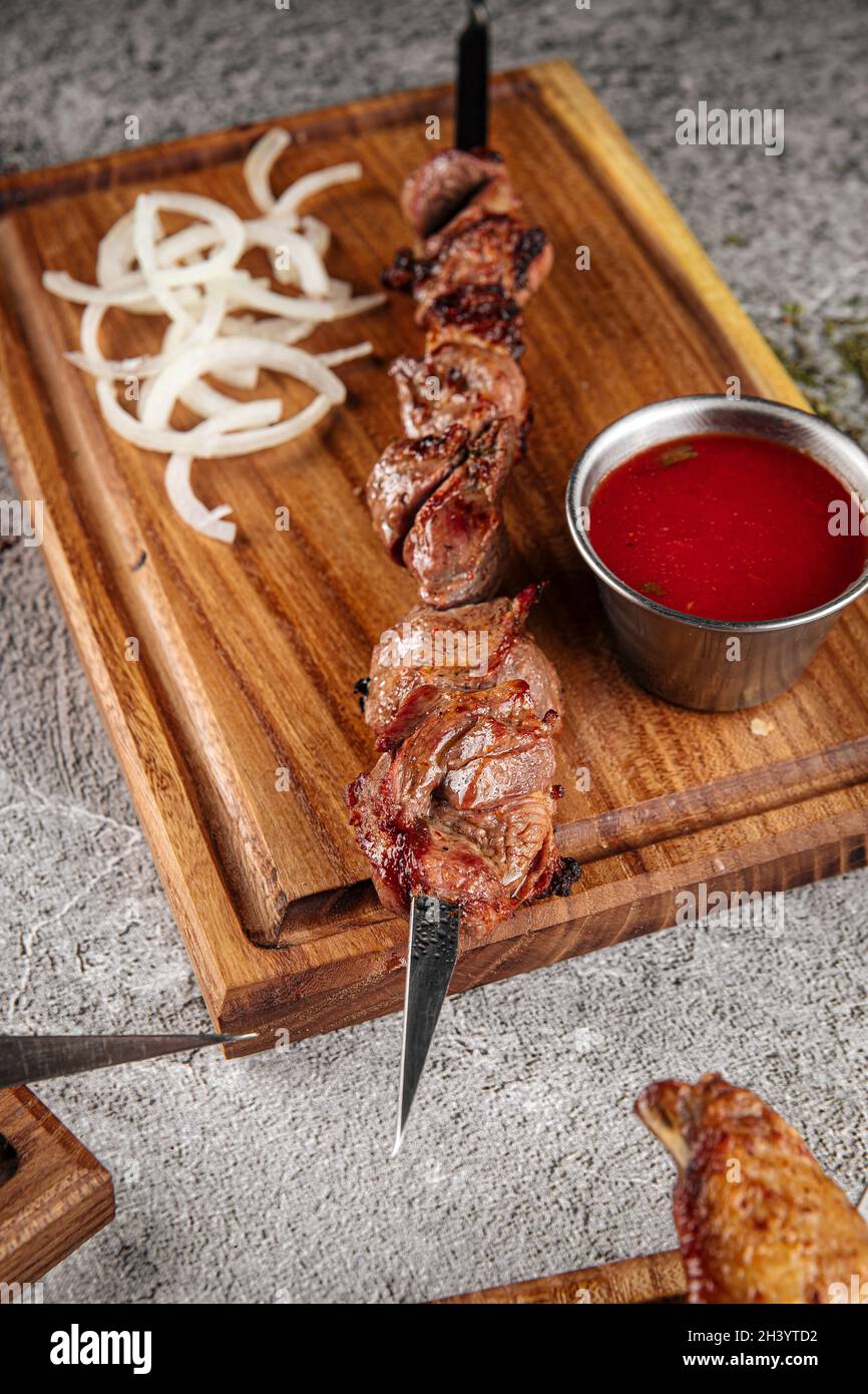 Grilled lamb shashlik with red sauce Stock Photo - Alamy