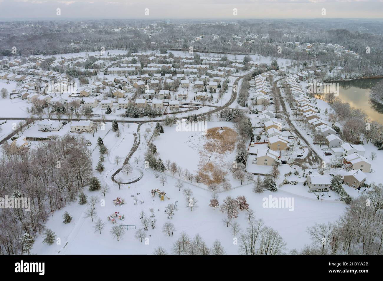 Aerial view of landscape small town with apartment complex covered in ...