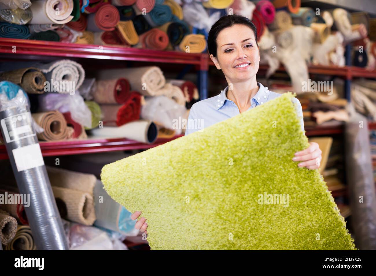Woman carpet buying hi-res stock photography and images - Alamy