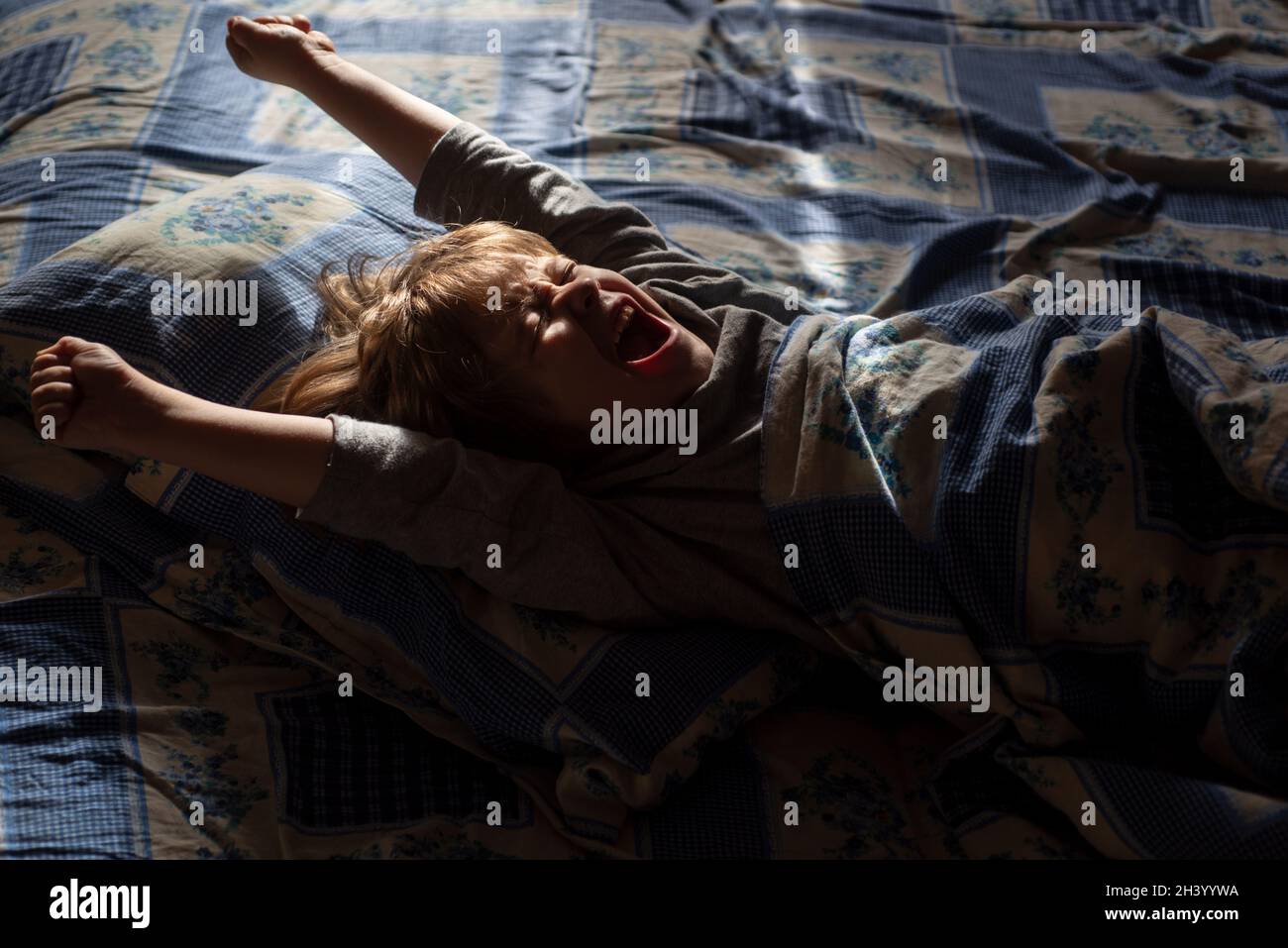 Child wake up in the bed. Adorable small kids rest asleep enjoy good ...