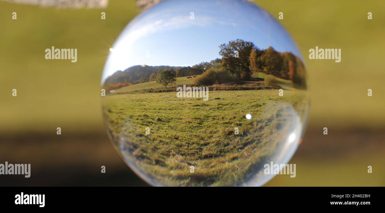 a beautiful landscape photographed through a lens ball Stock Photo - Alamy