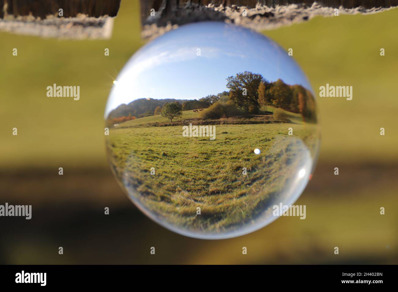 a beautiful landscape photographed through a lens ball Stock Photo - Alamy