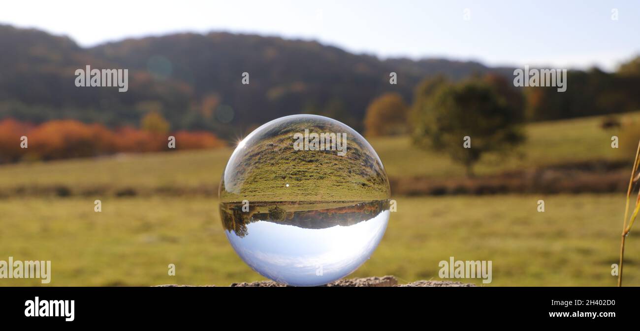 a beautiful landscape photographed through a lens ball Stock Photo - Alamy