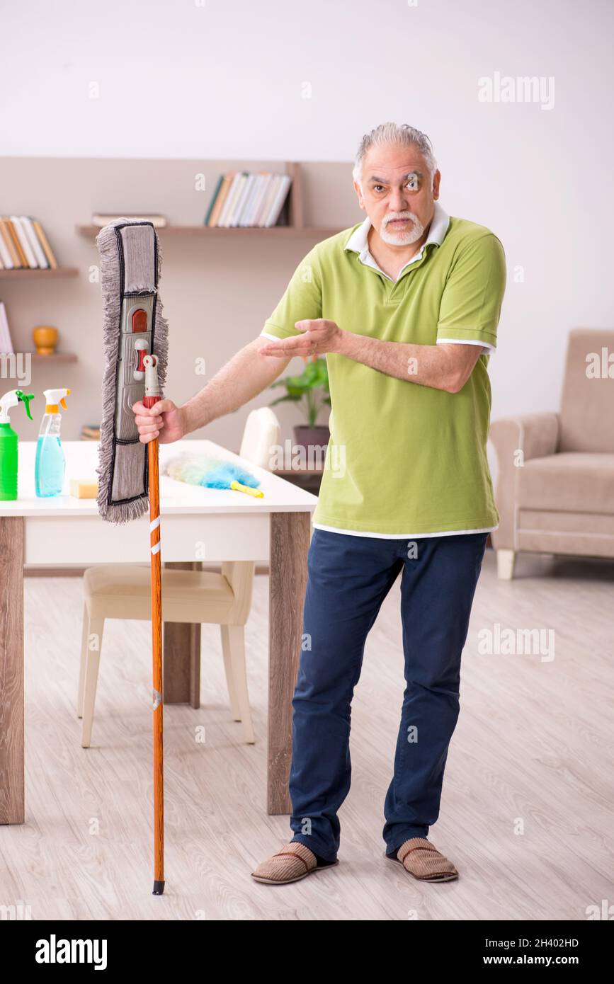 Old contractor cleaning house hi-res stock photography and images - Alamy