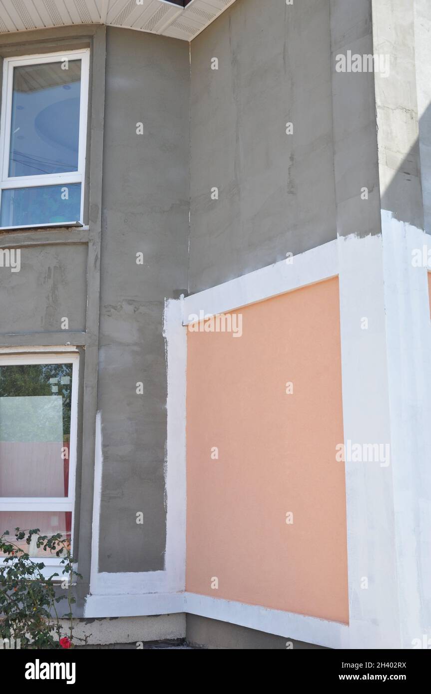 Renovation house paint walls outdoors. Painting house wall exterior ...