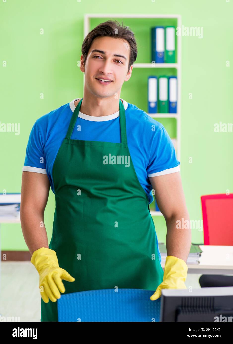 Male handsome professional cleaner working in the office Stock Photo ...