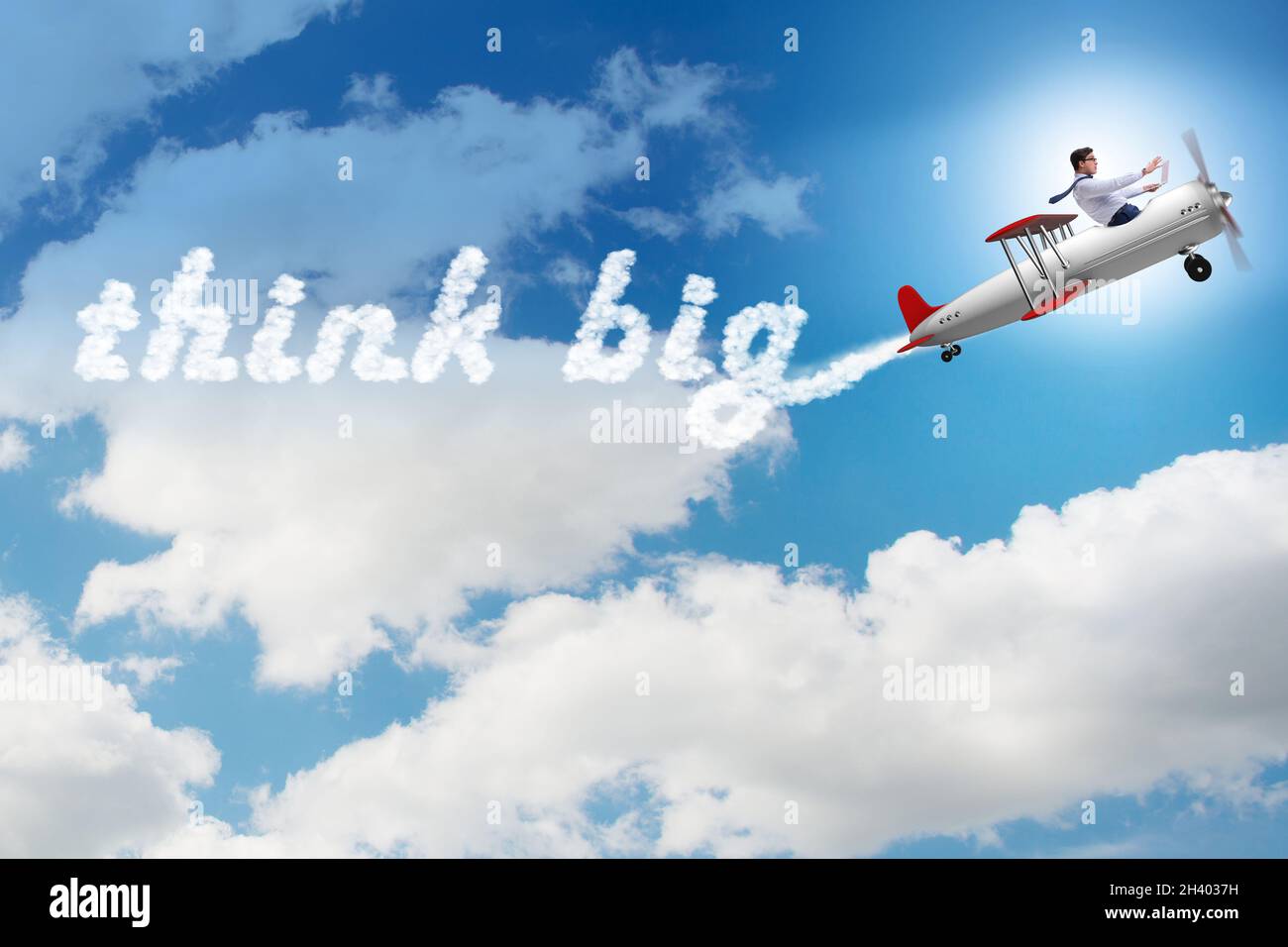 Think big concept with businessman Stock Photo - Alamy