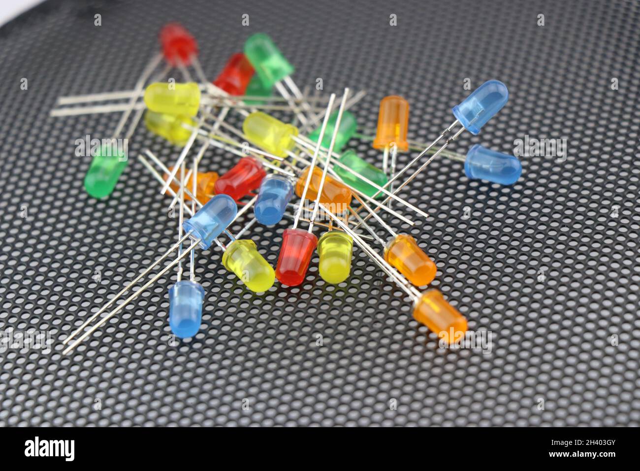 Set of colorful LEDs on black mesh background, Light emitting diodes ...