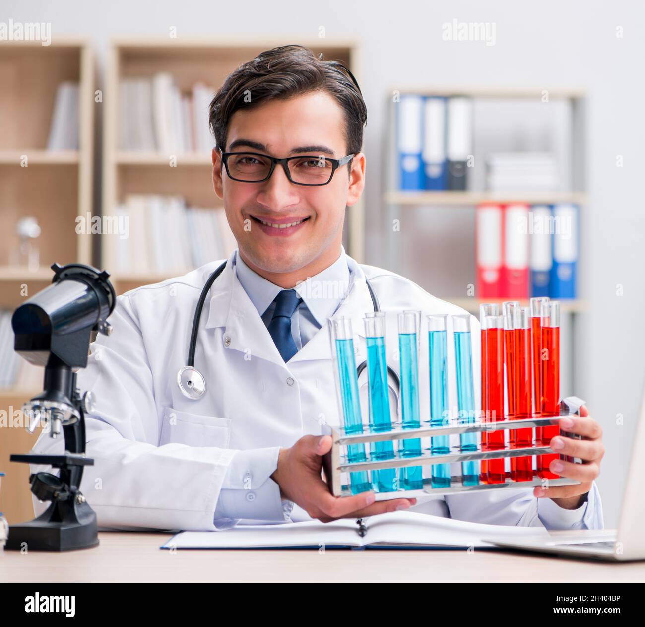 Man doctor working in the lab Stock Photo - Alamy