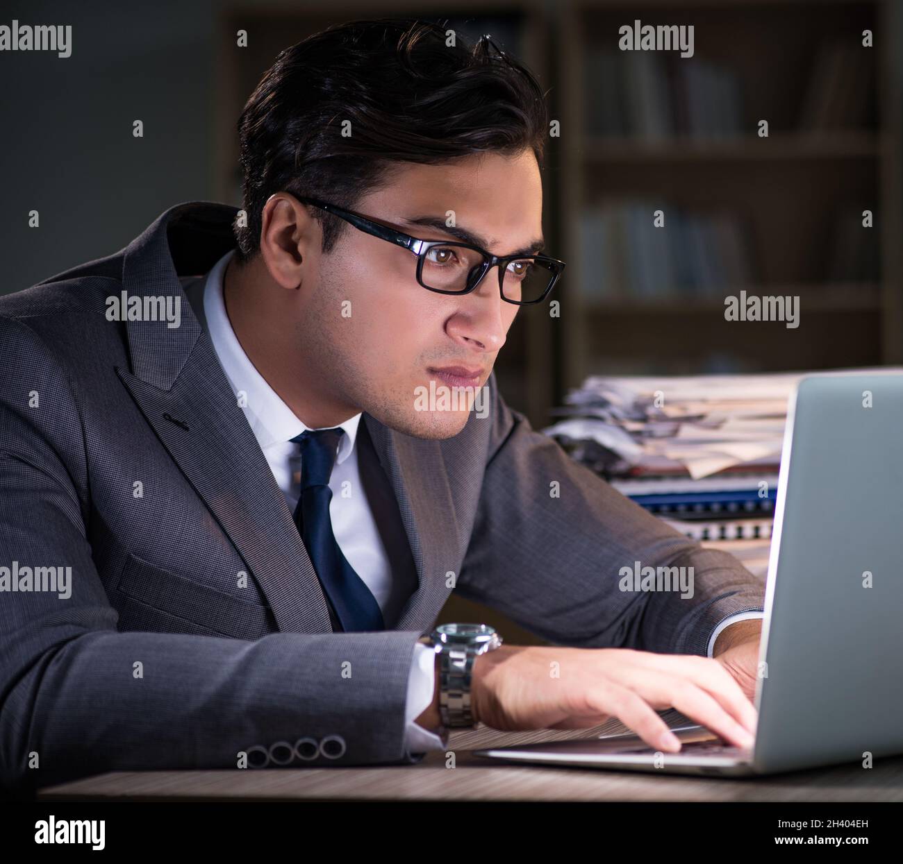 Man staying in the office for long hours Stock Photo - Alamy