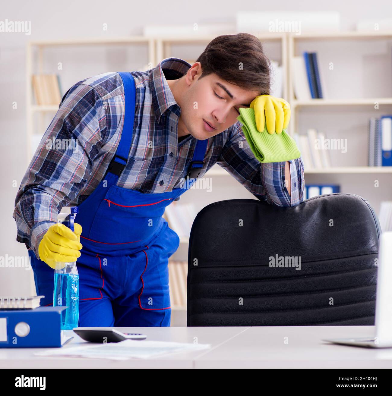 Tired male cleaner mopping hi-res stock photography and images - Alamy