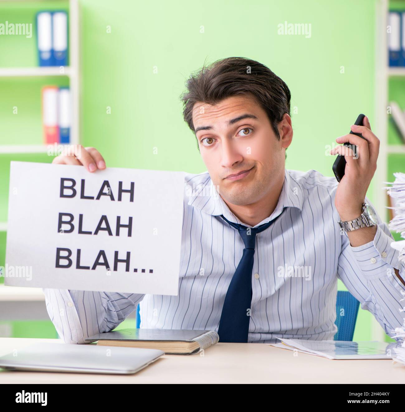 Businessman having problems with paperwork and workload Stock Photo - Alamy