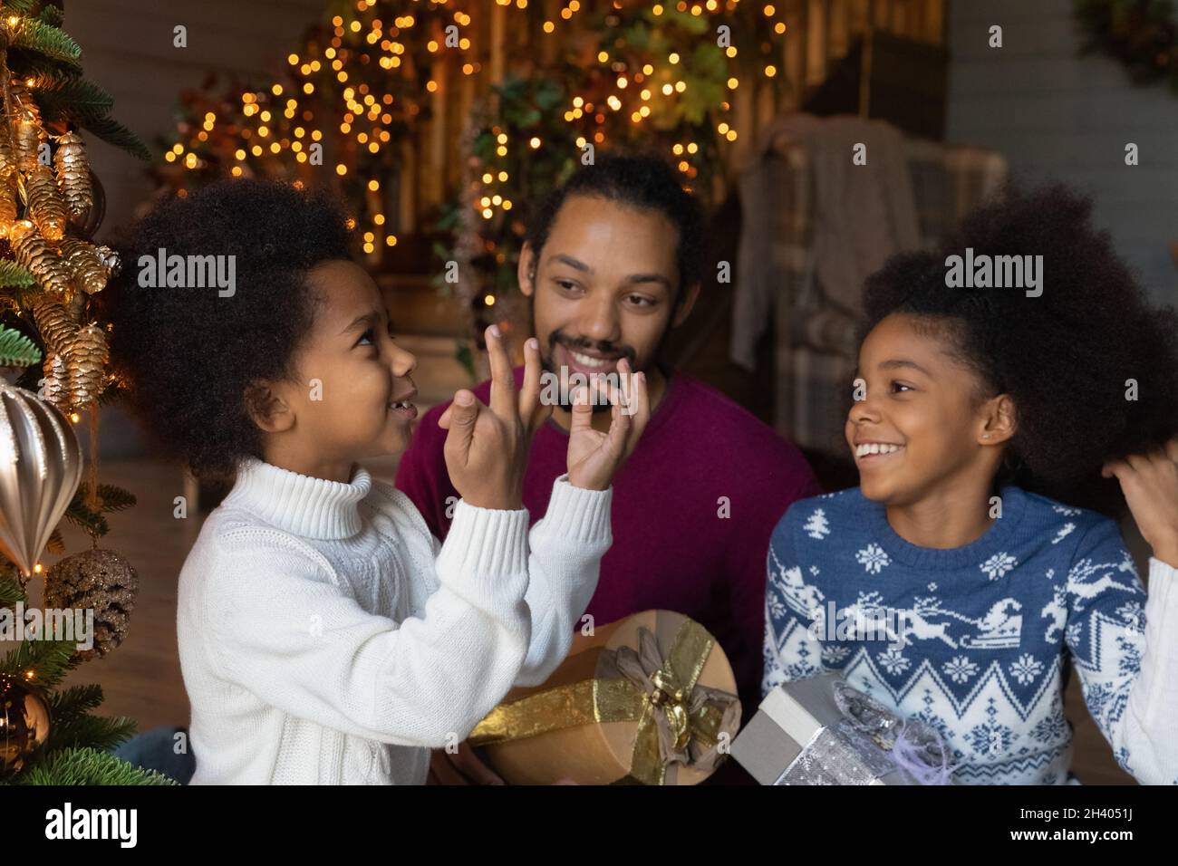 Happy biracial family celebrate Christmas at home together Stock Photo ...