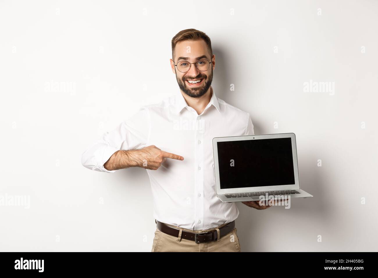 Professional manager showing webpage on laptop screen, pointing at ...