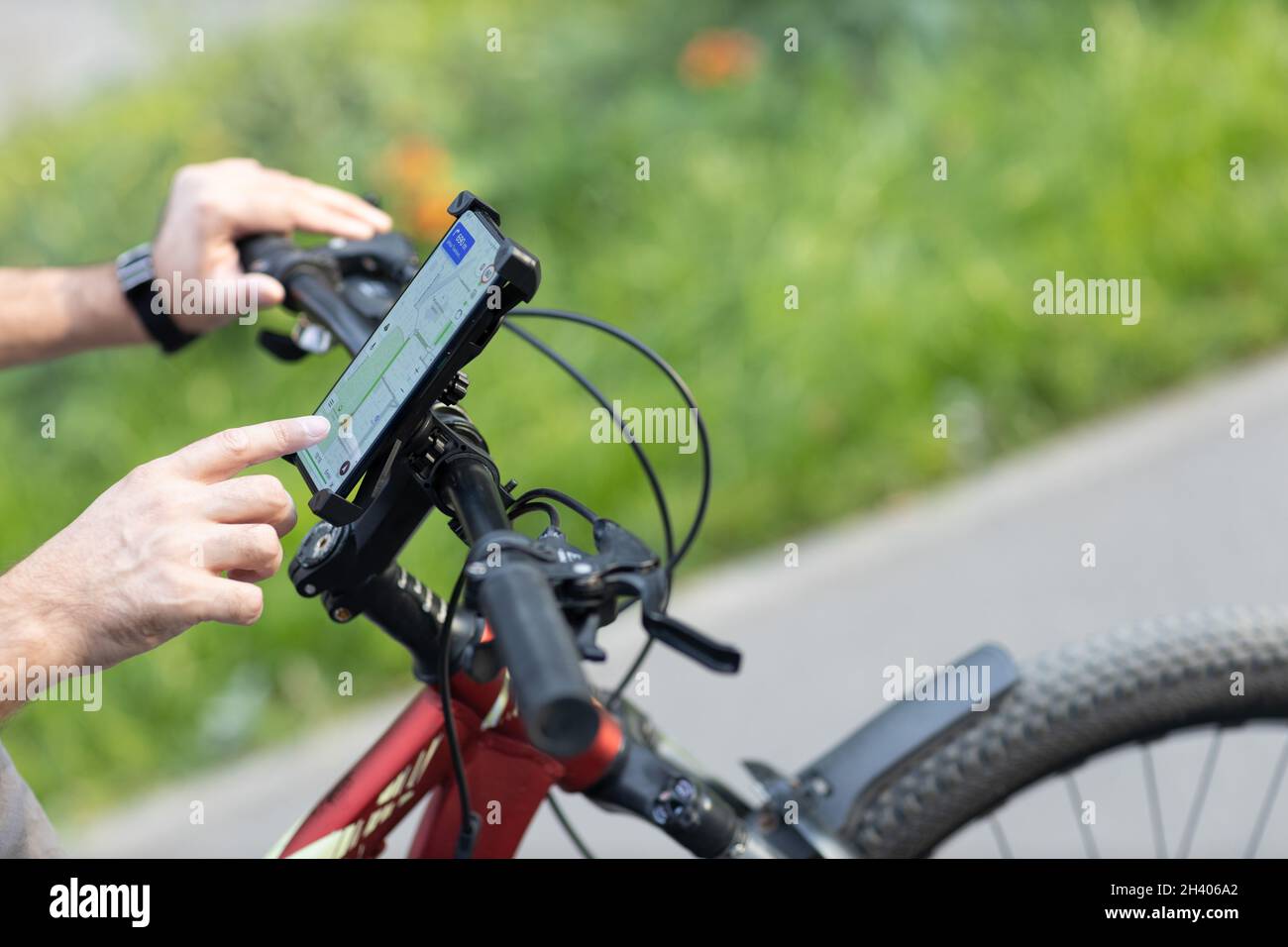 Man planning route using GPS navigation application in mobile phone on ...
