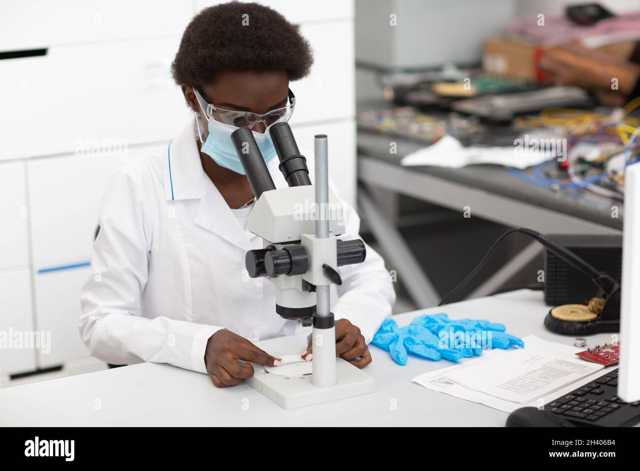 Woman microscope laboratory mask hi-res stock photography and images ...