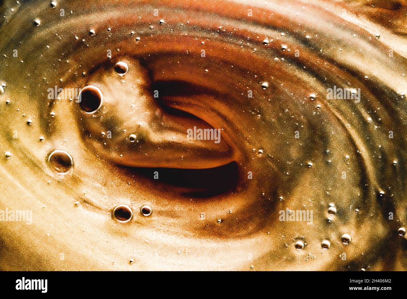 Abstract bronze liquid background, paint splash, swirl pattern and ...