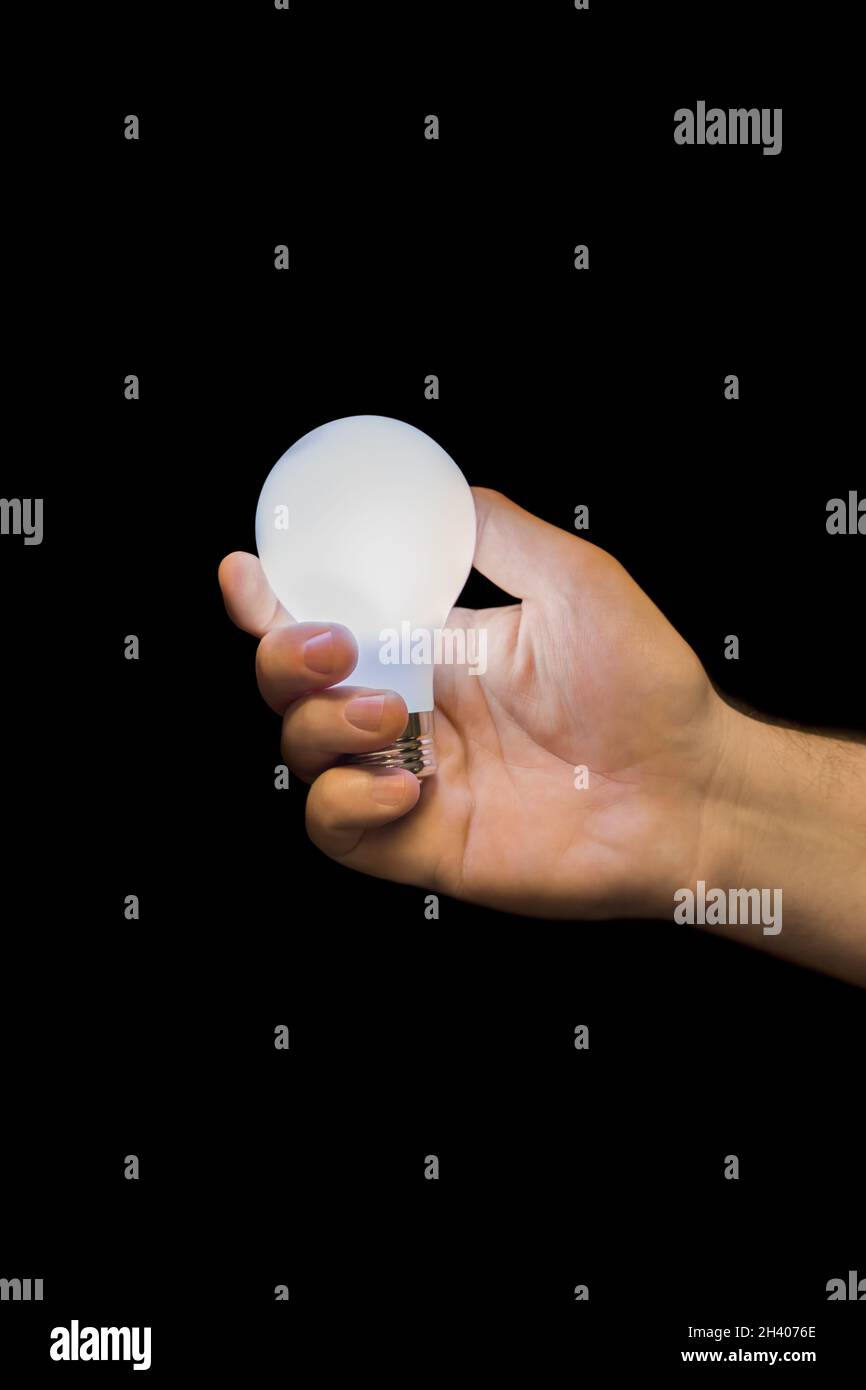 Lighting lamp in hand Stock Photo - Alamy