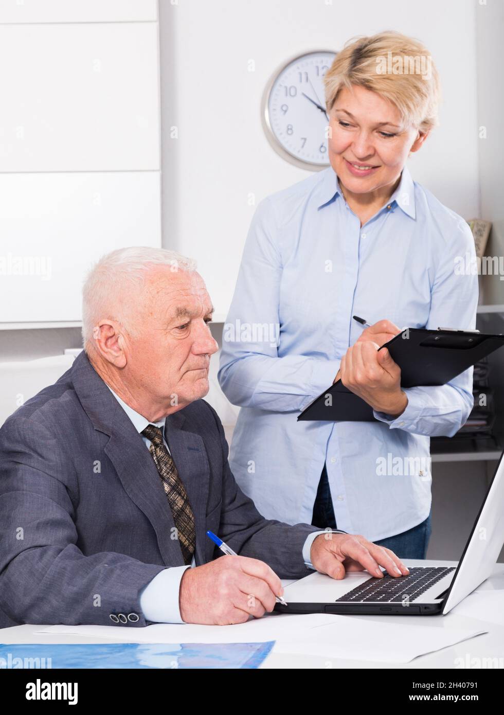 Manager and secretary working Stock Photo - Alamy