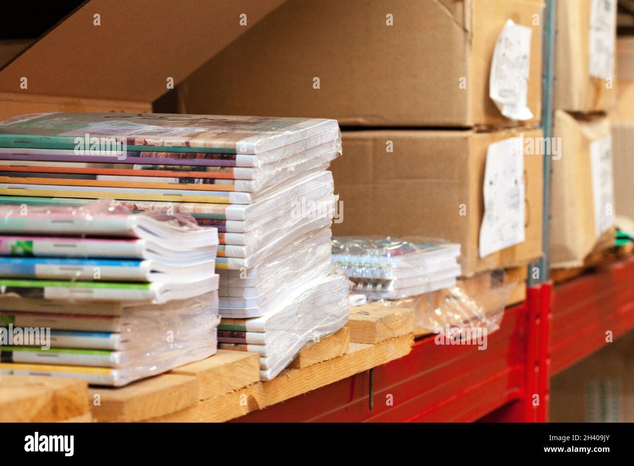 Cardboard sheets pack on a shelf of warehouse Stock Photo - Alamy