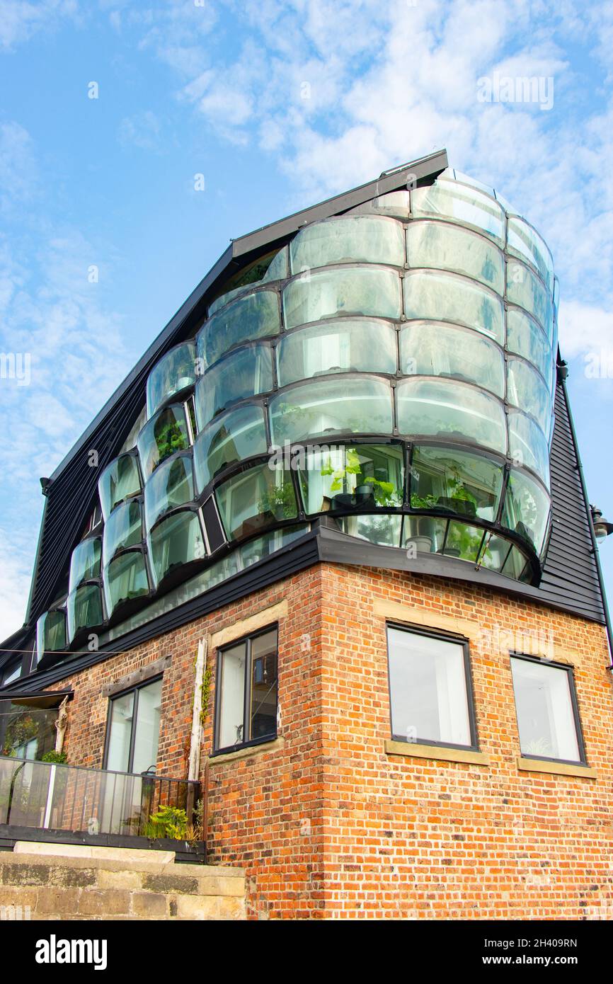 modern house and architects studio with large glass windows possibly ...