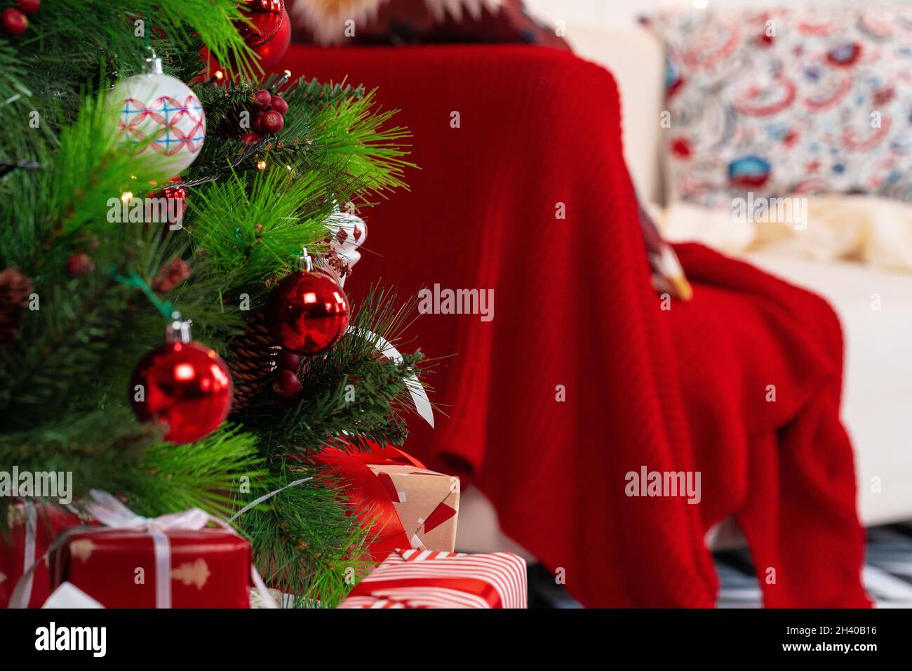 Red and white baubles hanging from a Christmas tree close up Stock ...