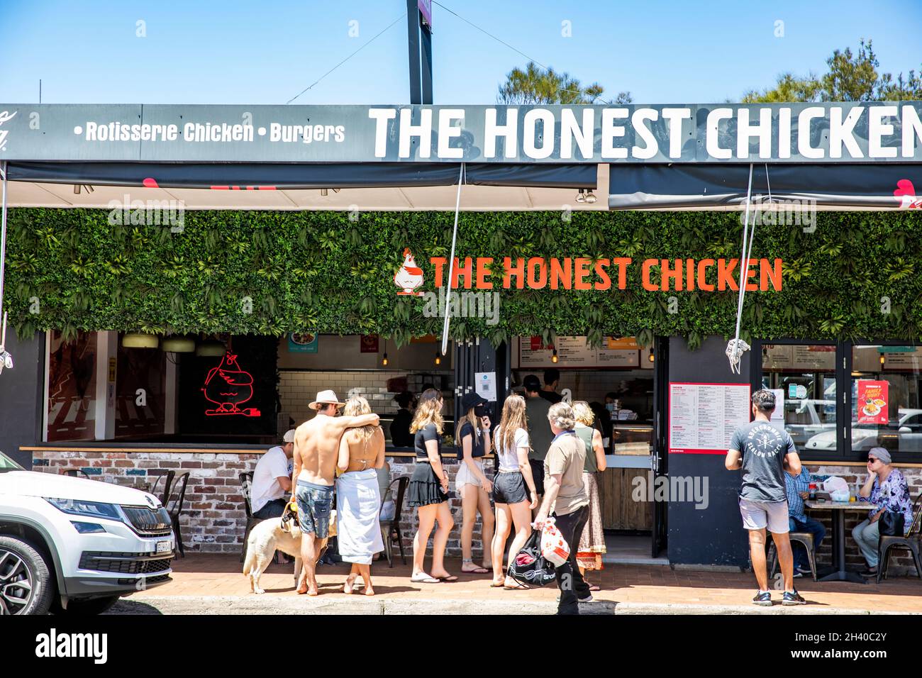 Takeaway food chicken shop, The Honest Chicken, with customers waiting ...