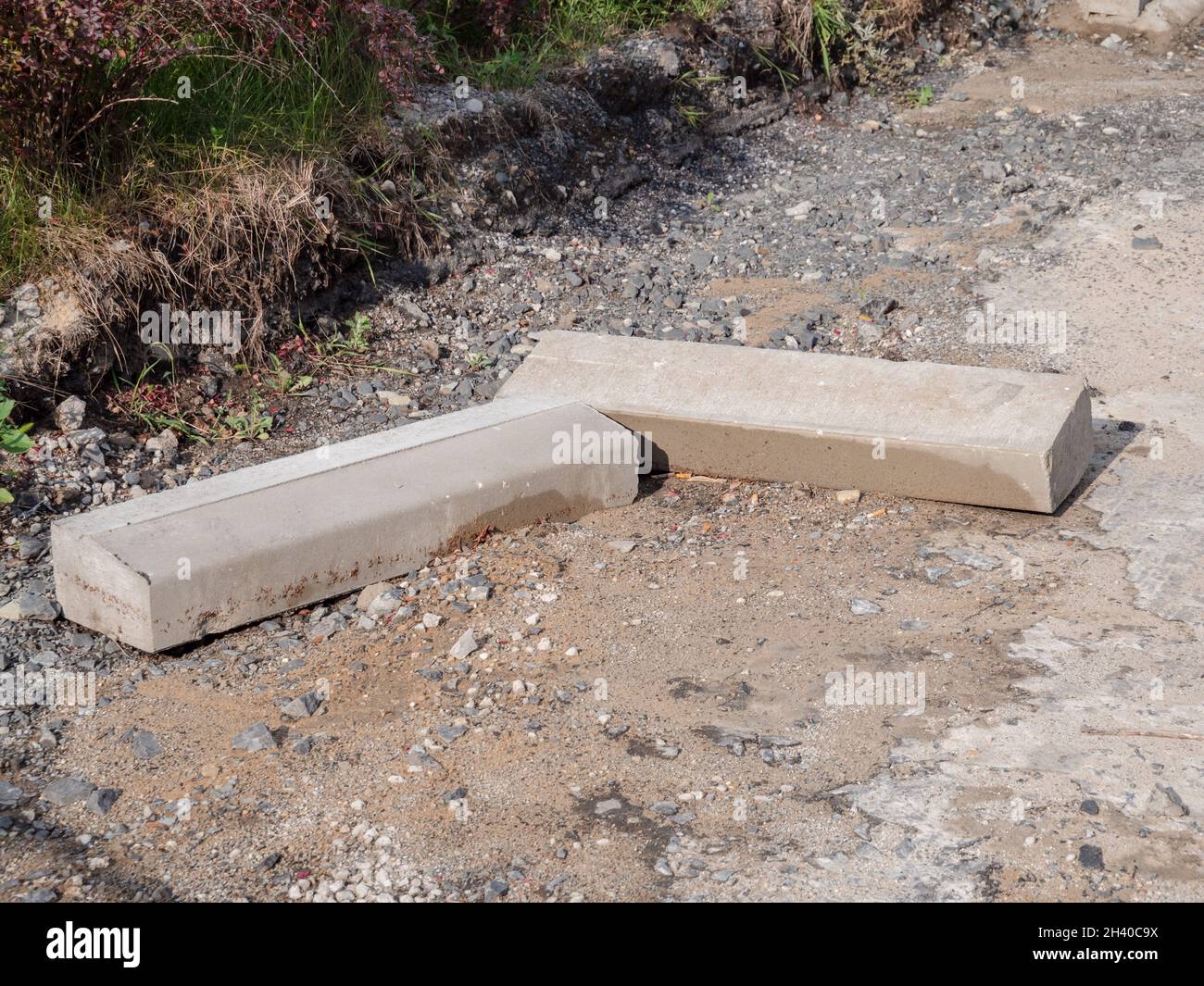 Concrete curb on road reconstruction between pavement and road ...