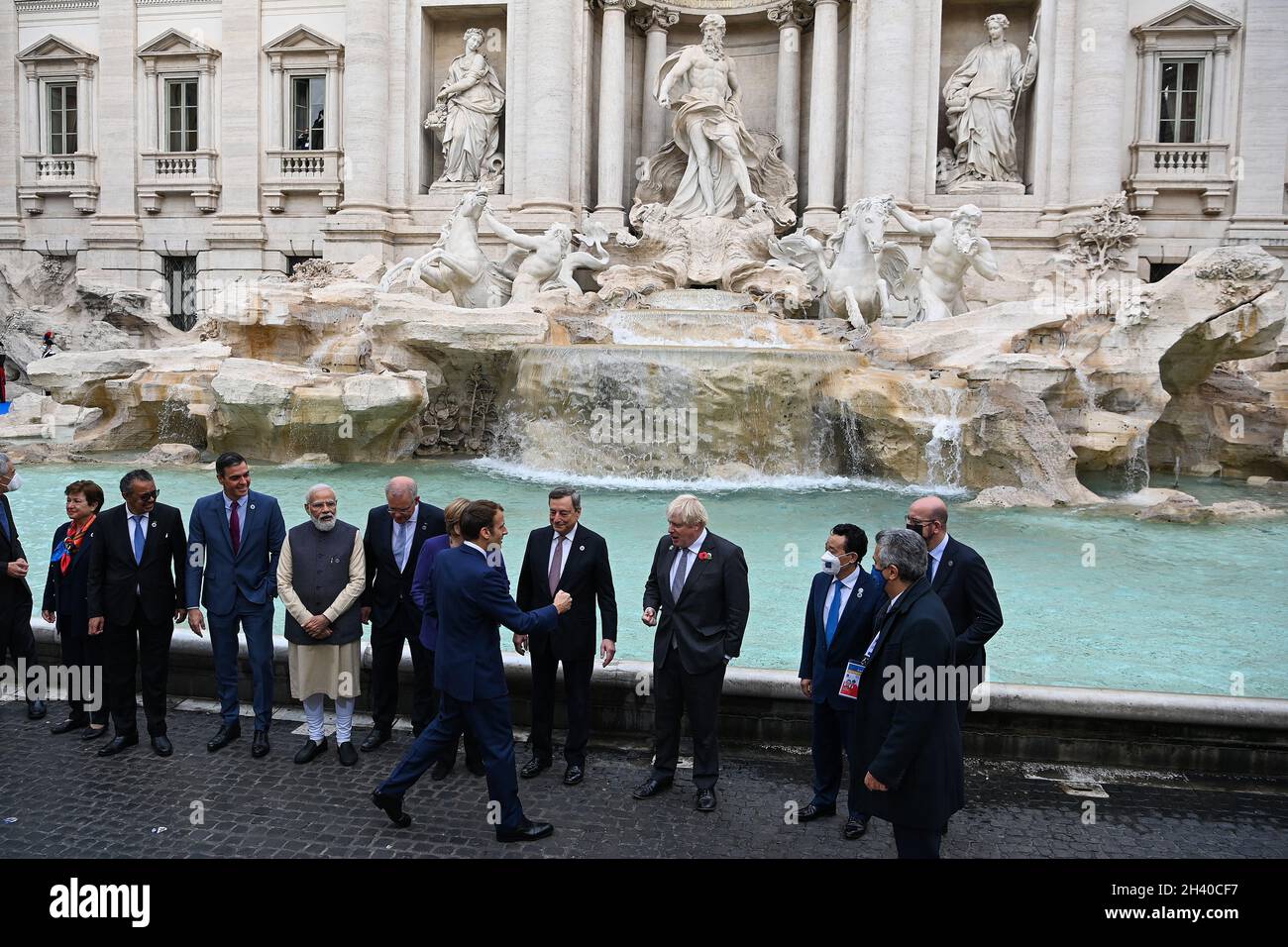 Prime Minister Boris Johnson greets French President Emmanuel Macron as ...