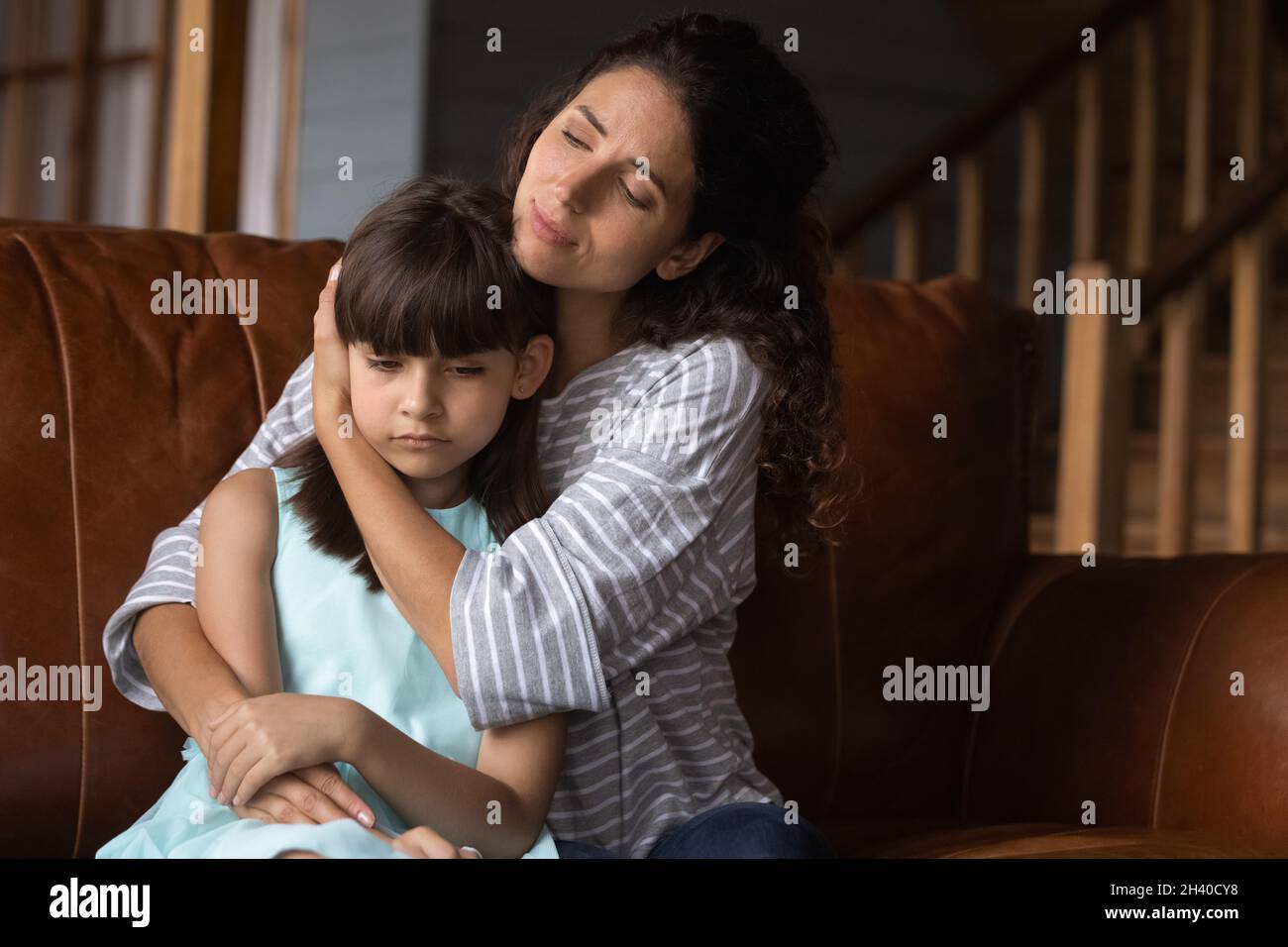 Sad daughter hugging mother home hi-res stock photography and images - Alamy