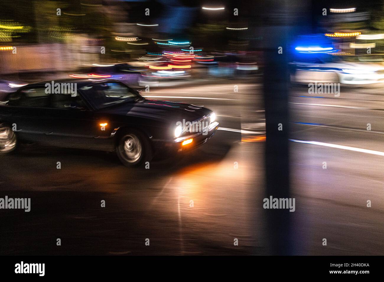 Police car in motion in Rome Italy, blurred background Stock Photo - Alamy