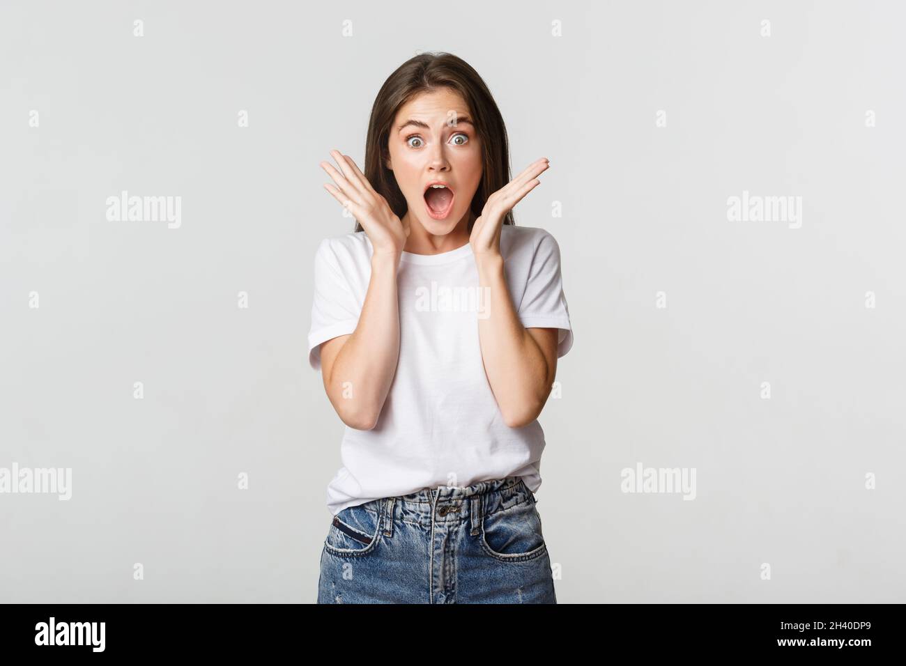 Surprised and amazed brunette girl gasping, drop jaw impressed Stock ...