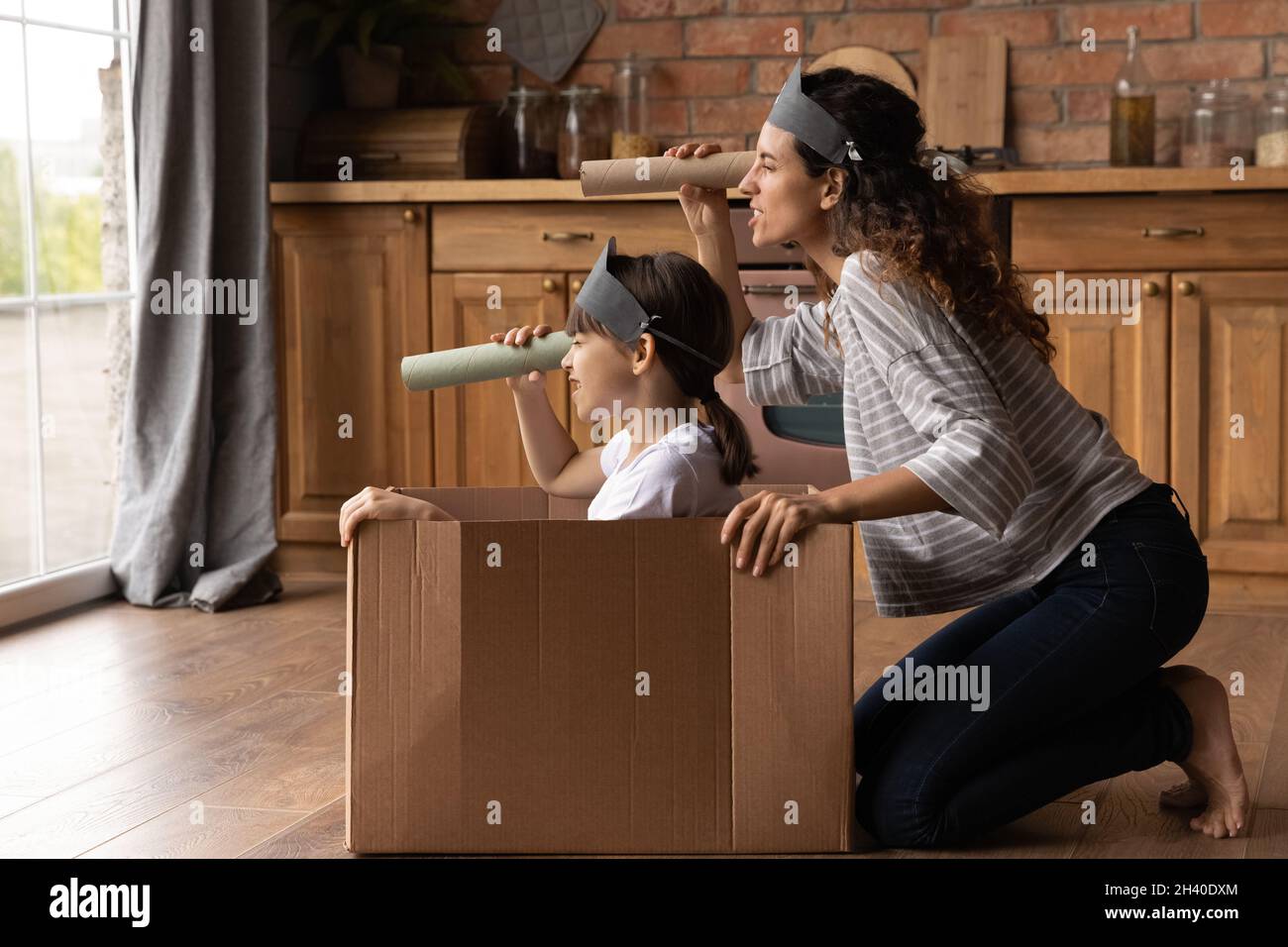 Happy creative mother and active daughter girl playing pirates Stock ...