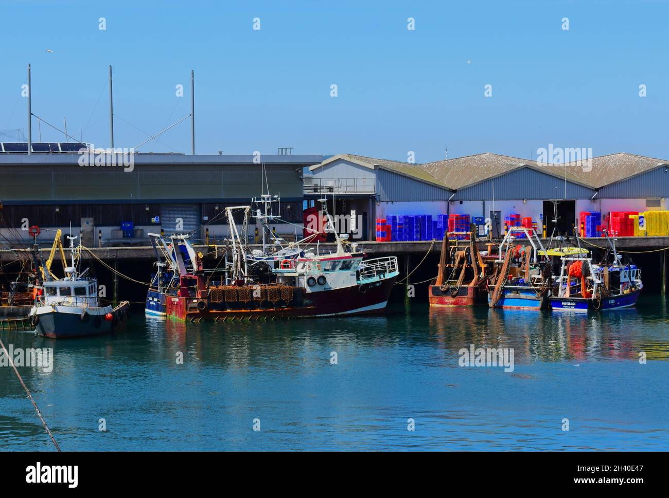 A group of modern trawlers in Brixham Harbour close to the wholesale ...