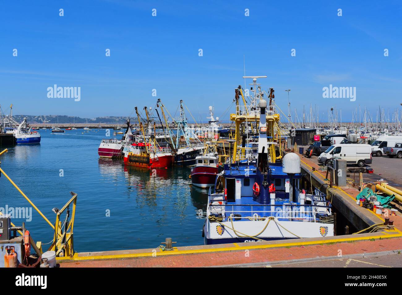A group of modern trawlers in Brixham Harbour close to the wholesale ...