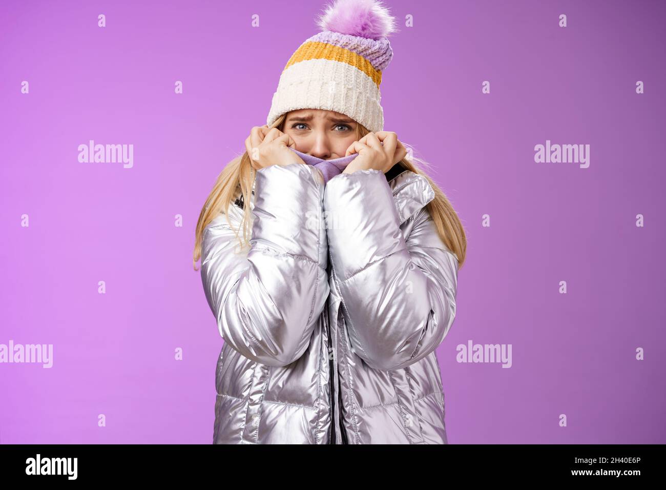 Scared afraid insecure coward girl in cute hat glittering shiny jacket ...