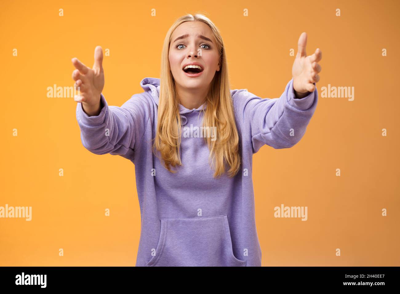 Excited fascinated glad blond woman adore singer performing stage ...