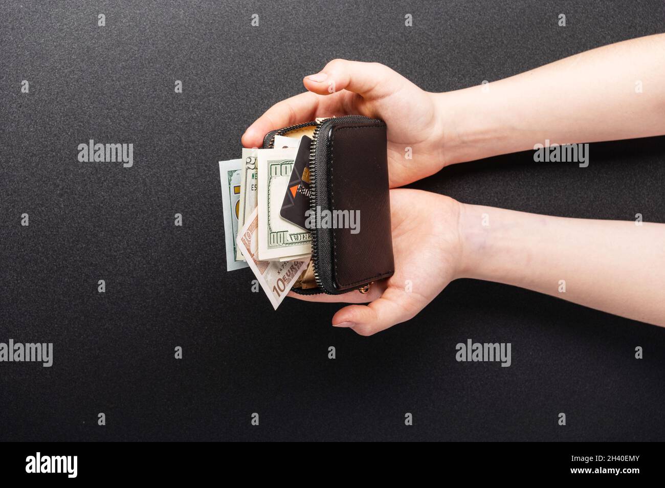 Money in the wallet. Keep a wallet with money. Outstretched hands with ...