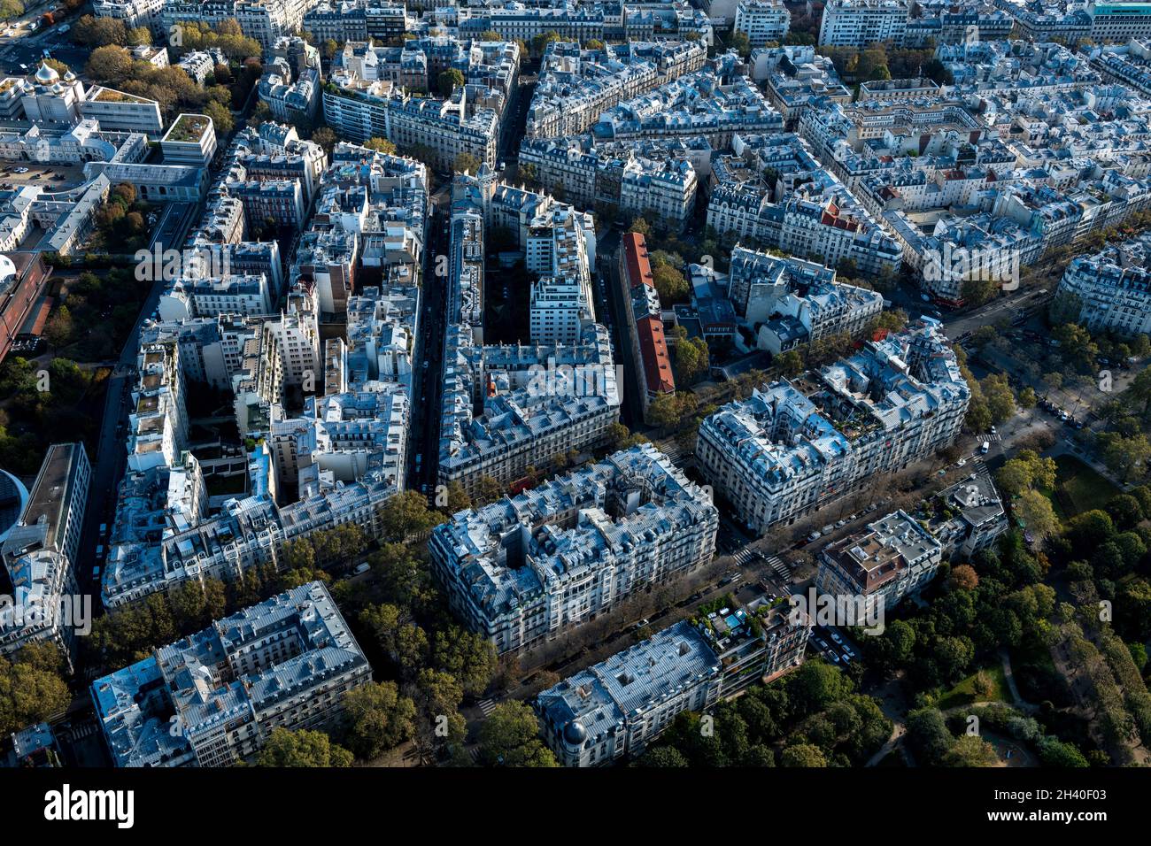 Aerial view looking down at colorful rooftops of buildings and streets ...
