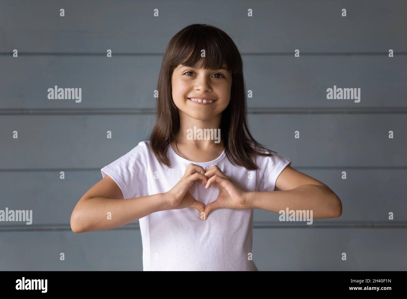 Child hand making heart hi-res stock photography and images - Alamy