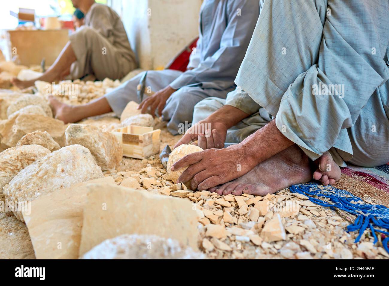 master works with the stone in the old way Stock Photo - Alamy