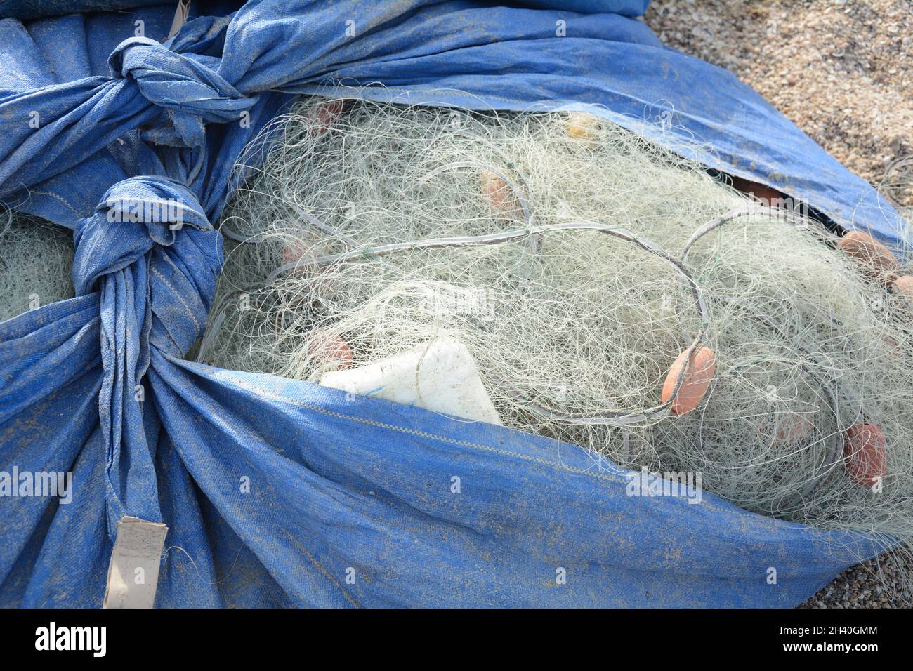 Fishing nets with buoys and ropes. Fishing nets ropes and floats on a ...